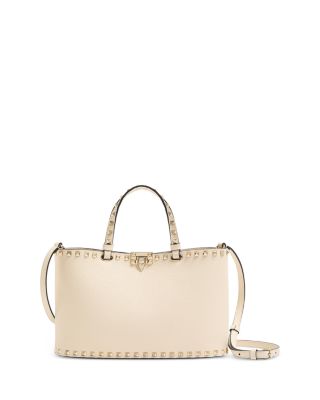 Click here for Valentino Garavani Rockstud Small Top Handle Bag prices