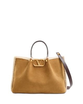 Click here for Valentino Garavani Medium VLogo Suede and Shearlin... prices