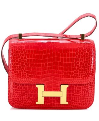 Click here for Pre-Owned HERMES 24 Constance Bag Shiny Porosus Cr... prices